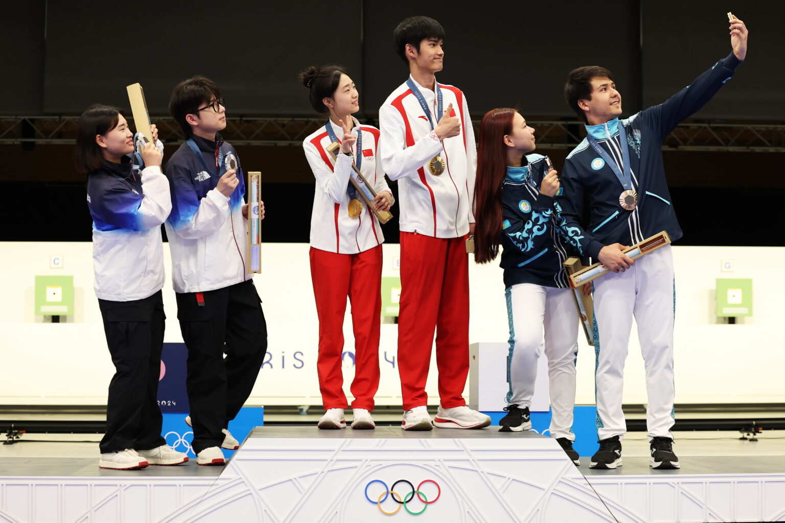 For the first time in history, medalists share their winning smiles ...